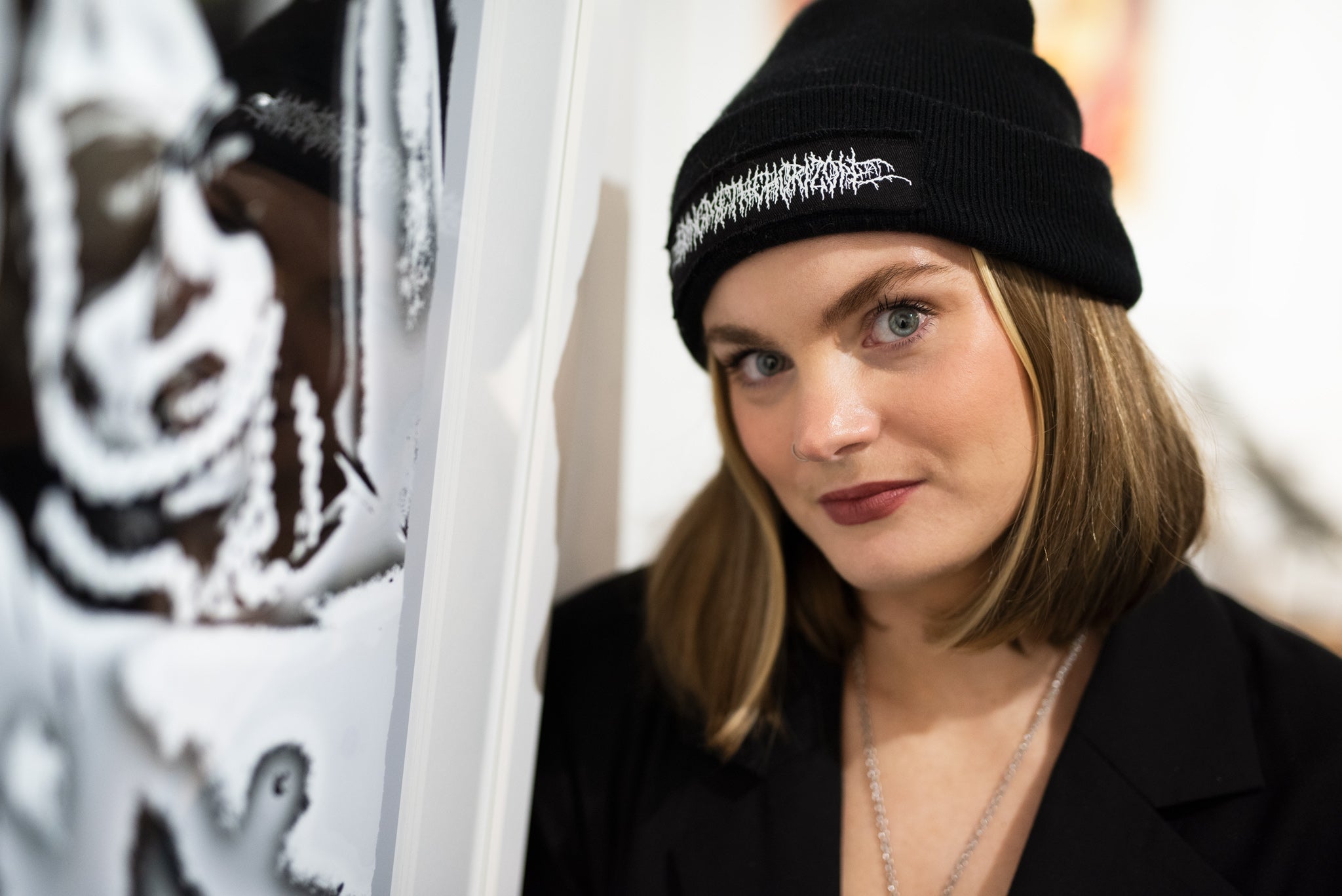 MODEL POSING WITH ARTWORK BY BRIAN A REID – Nationwide Curating